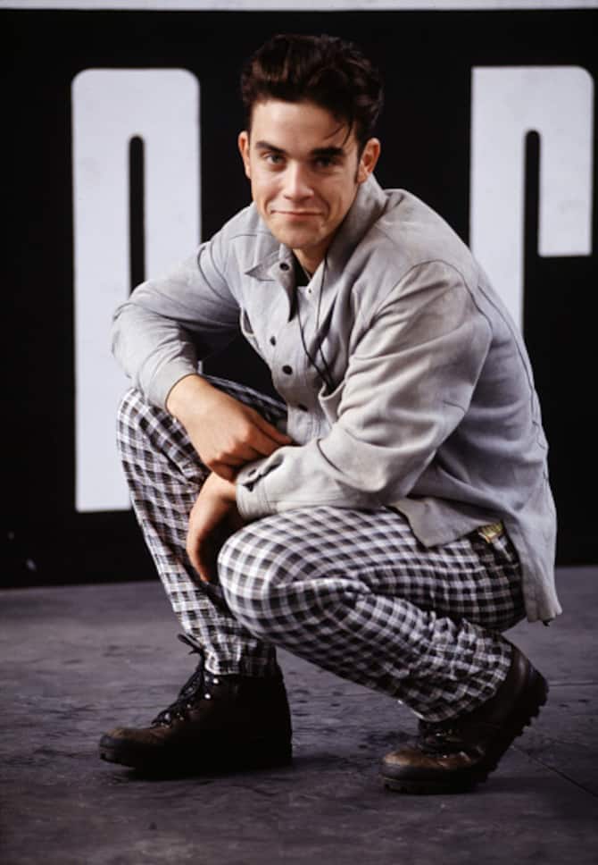 Robbie Williams ieri e oggi: ecco com'è cambiato il cantante